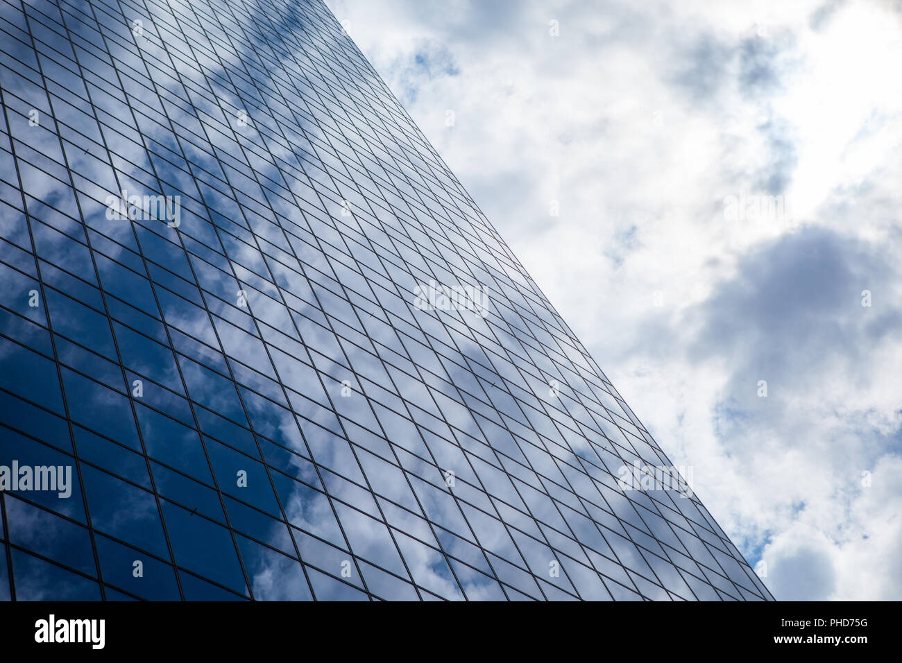 Blue office building with clouds reflection Stock Photo - Alamy