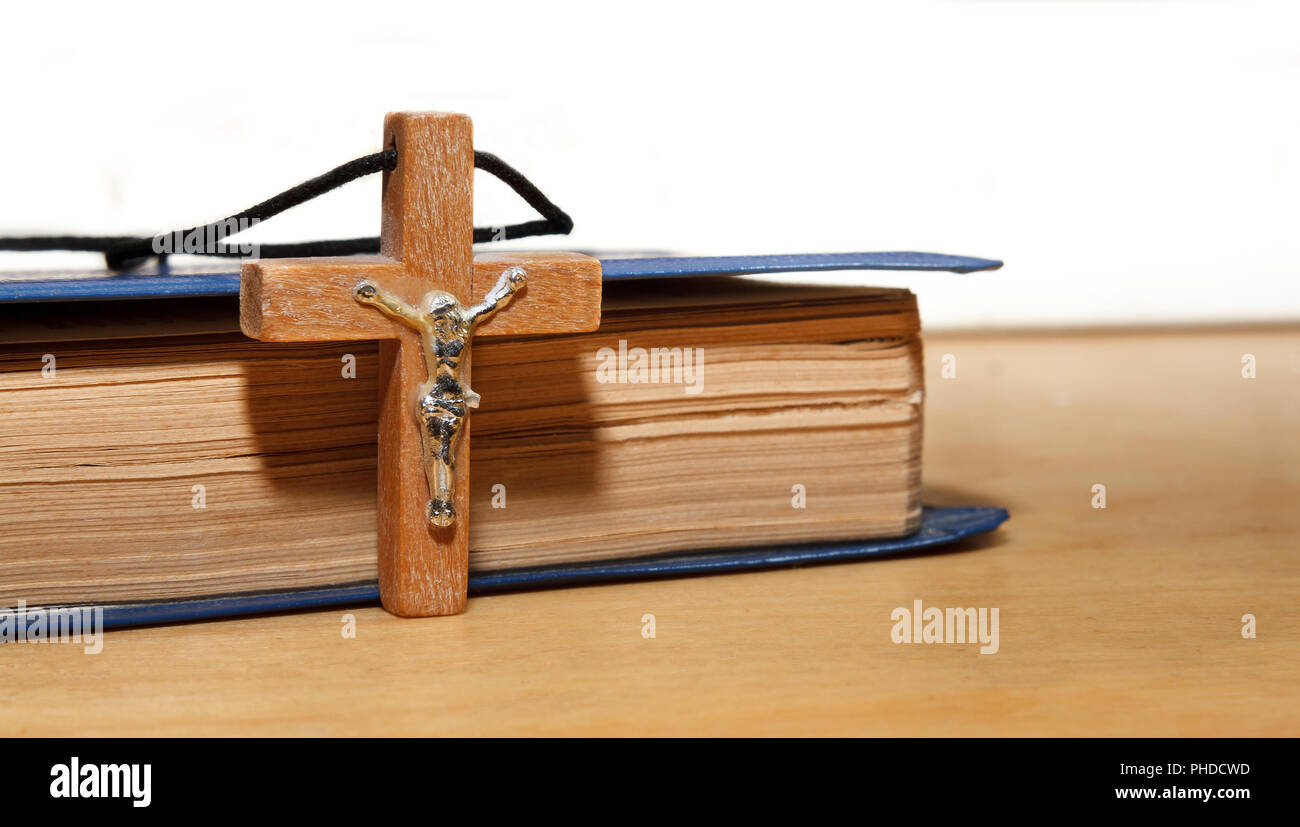 Book and a wooden cross Stock Photo - Alamy