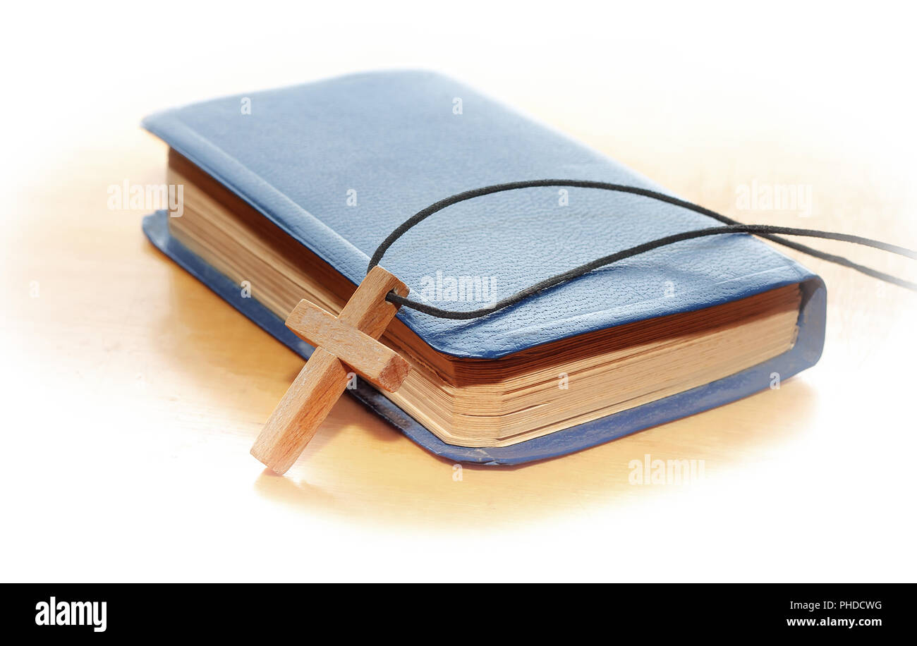 Book and a wooden cross Stock Photo - Alamy