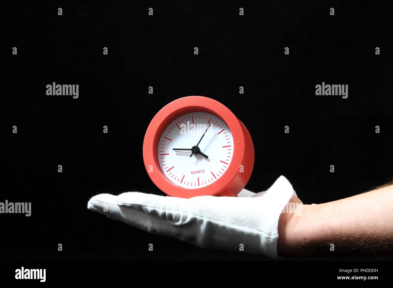 Clock And an Hand Stock Photo - Alamy