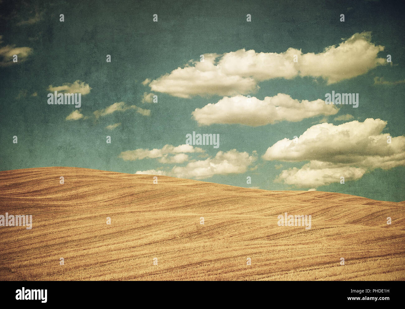 vintage style landscape, clouds over the hills Stock Photo - Alamy