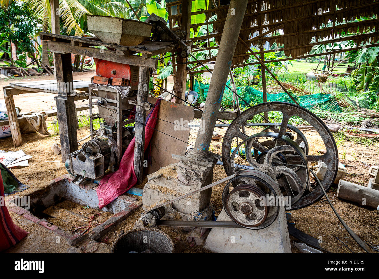 Rice Husk machine next to a farm house in Camboida by Siem Reap. AFter ...