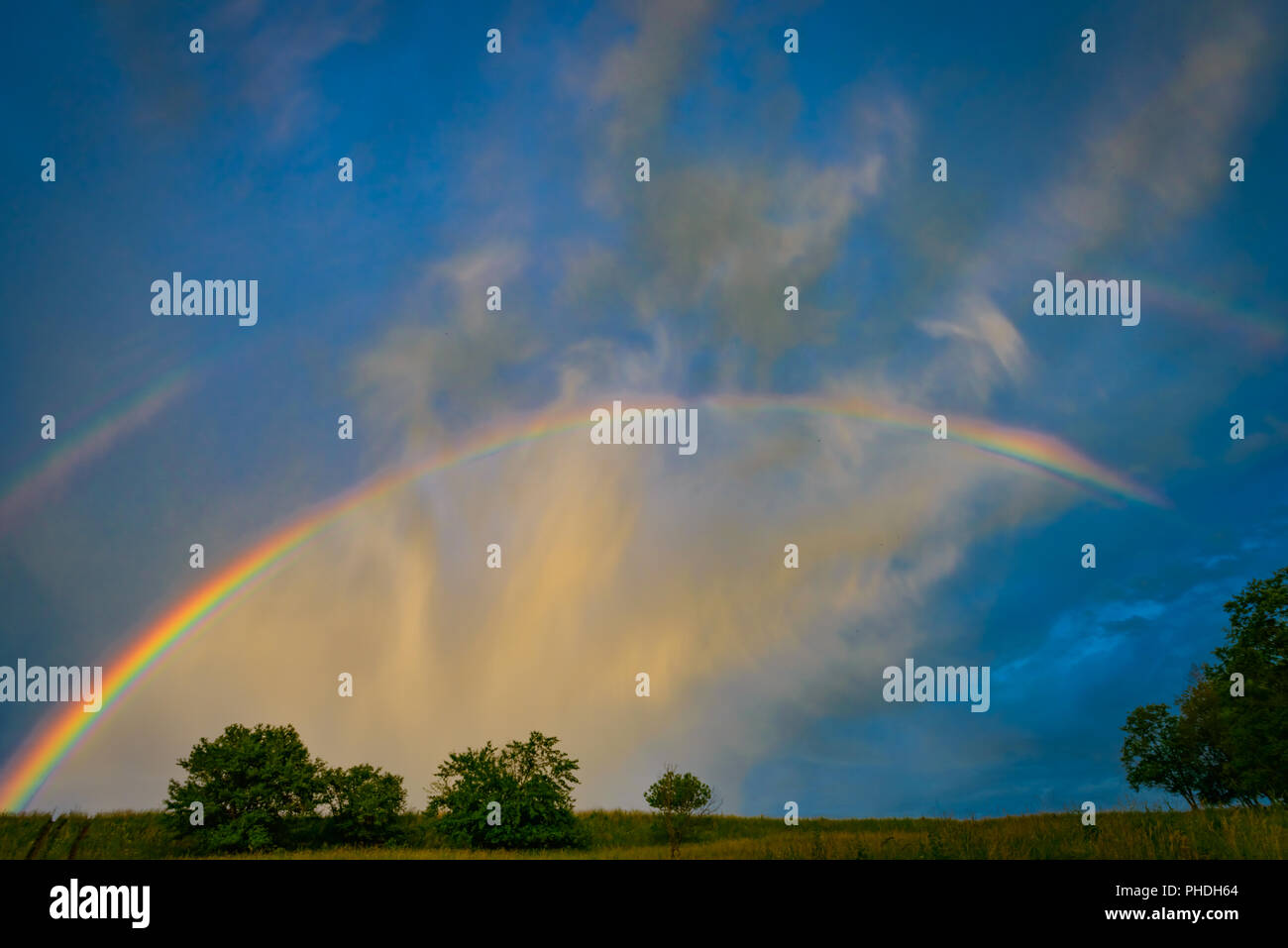 Rainbow clouds rain sun blue sky hi-res stock photography and images ...