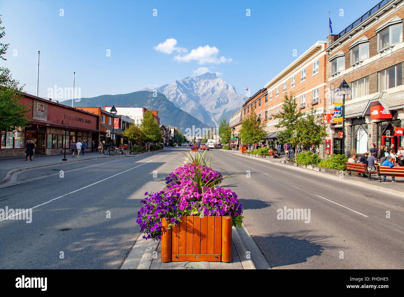 BANFF, CANADA - AUG 20, 2018: Banff Avenue inside Banff National Park with Cascade Mountain in ...