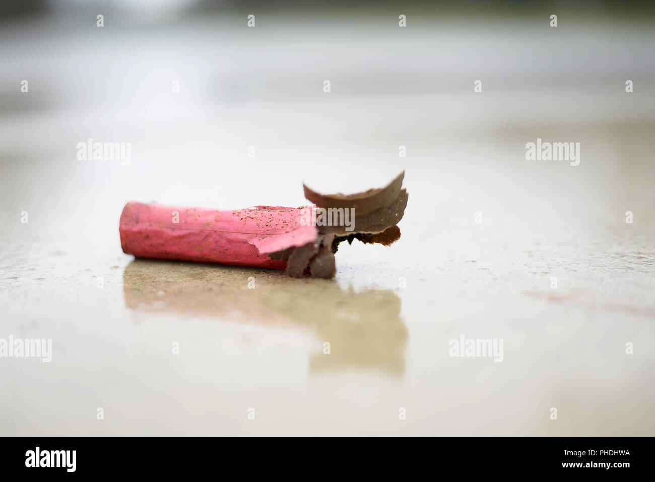 exploded old firecracker on street Stock Photo - Alamy