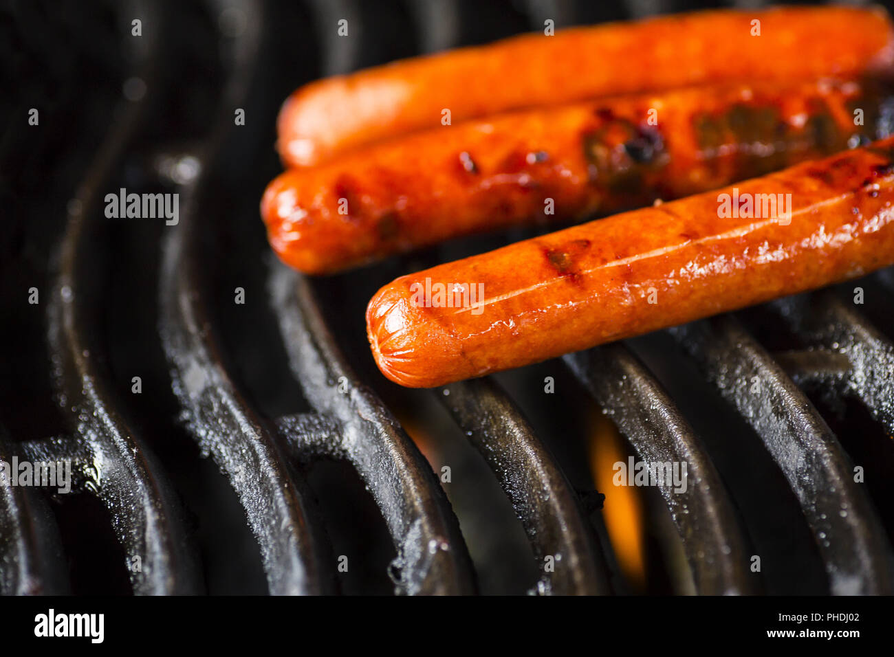 Sausage on a grill Stock Photo - Alamy