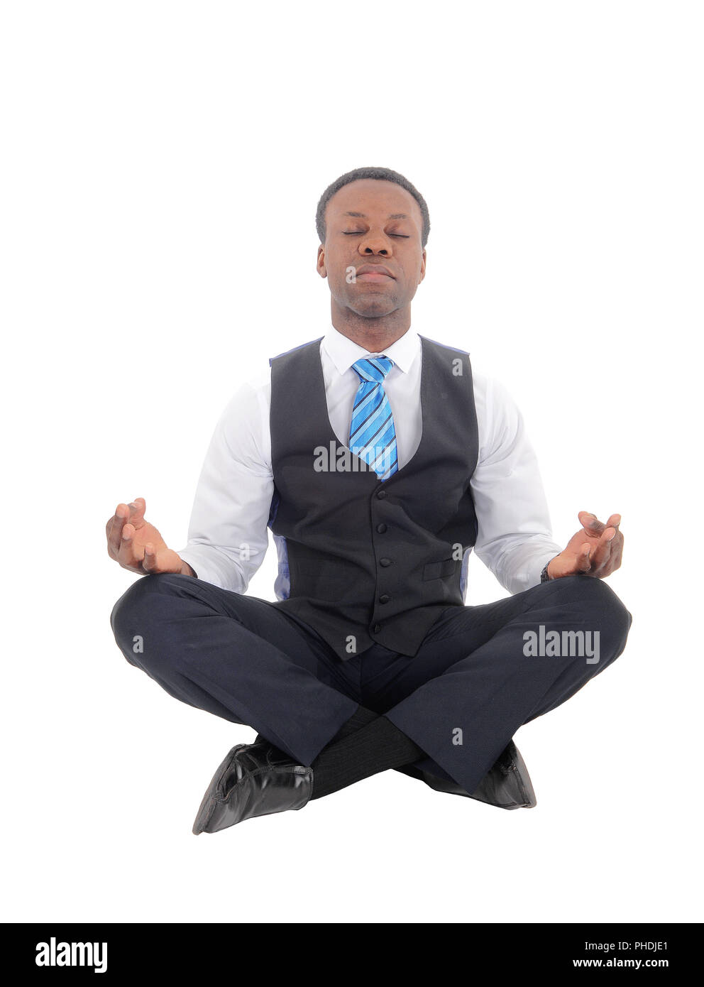 Handsome African man sitting doing yoga Stock Photo - Alamy