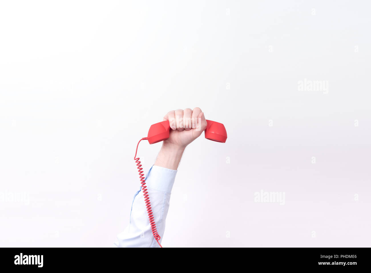 Arm holds a phone Stock Photo - Alamy