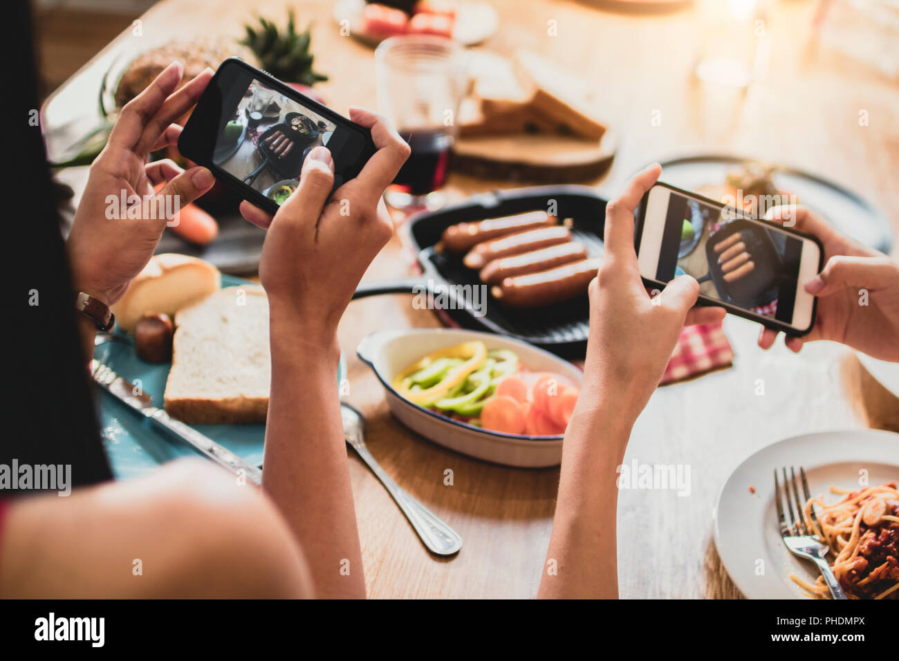 Enjoy dinner eating party and celebration with friends and taking photo ...