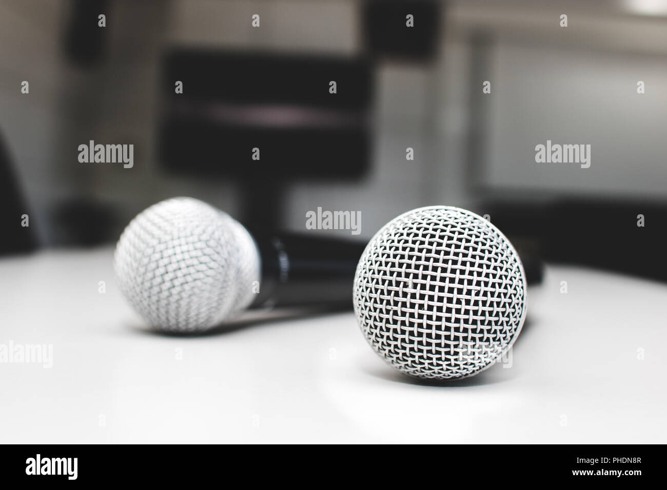 Microphone on table in meeting room Stock Photo - Alamy