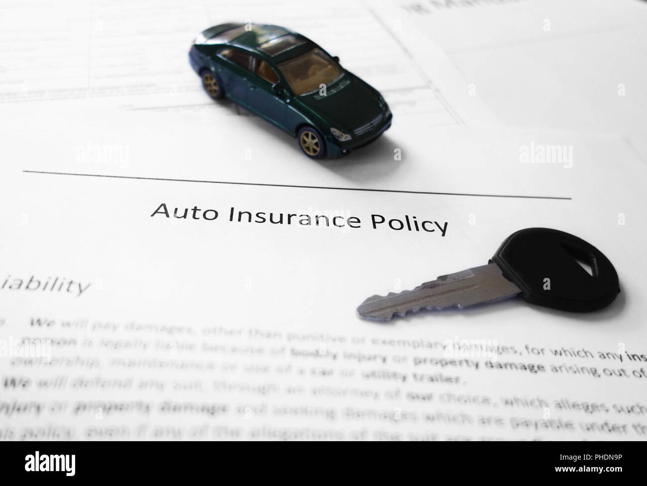 Car insurance and key Stock Photo - Alamy