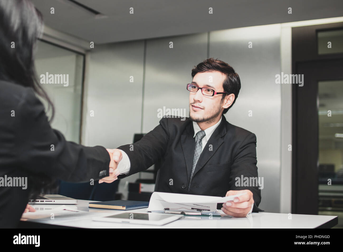 businessman shake hands with candidate after finishing interview for a ...