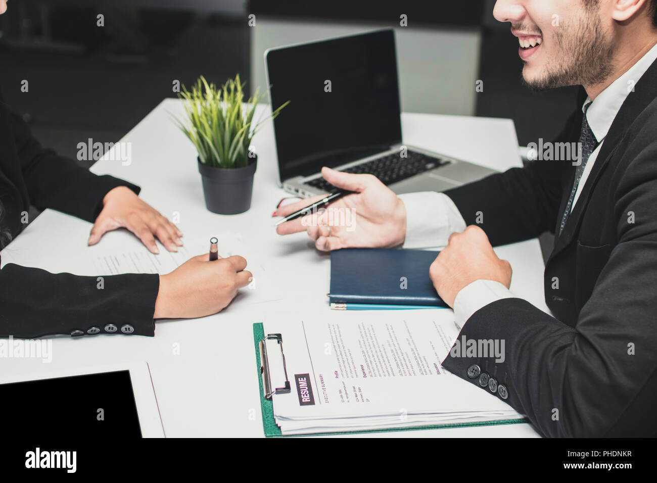 Smiled and happy manager businessman explaining, introducing, talking ...