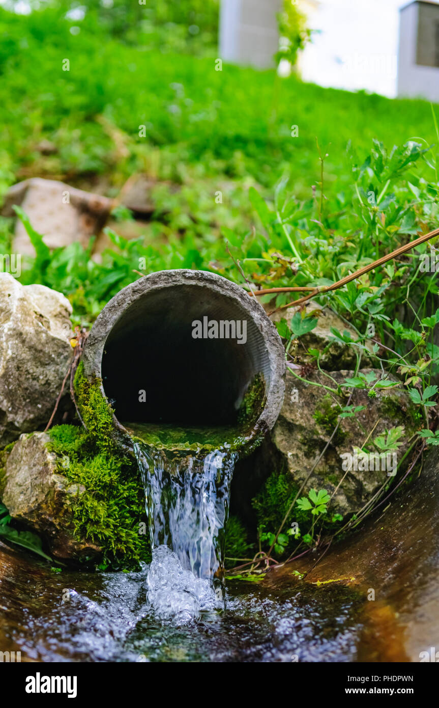Water flowing from pipe hi-res stock photography and images - Alamy