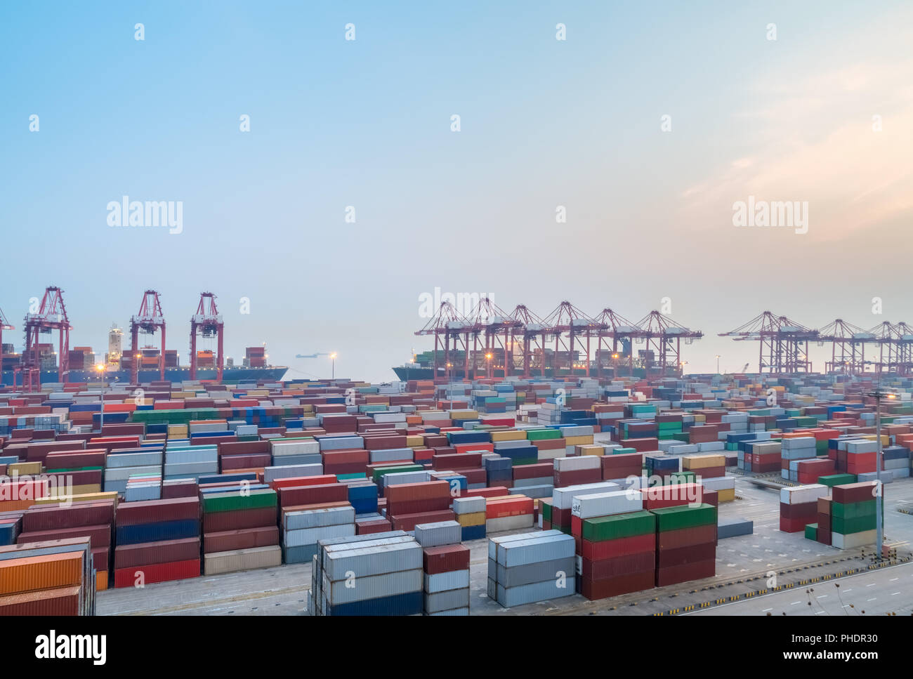 modern container terminal at dusk Stock Photo - Alamy