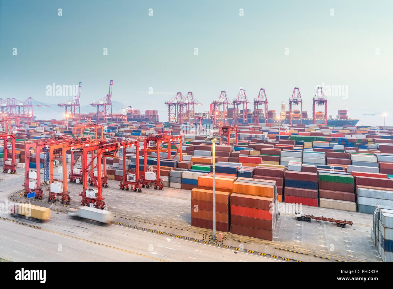 shanghai container port in nightfall Stock Photo - Alamy