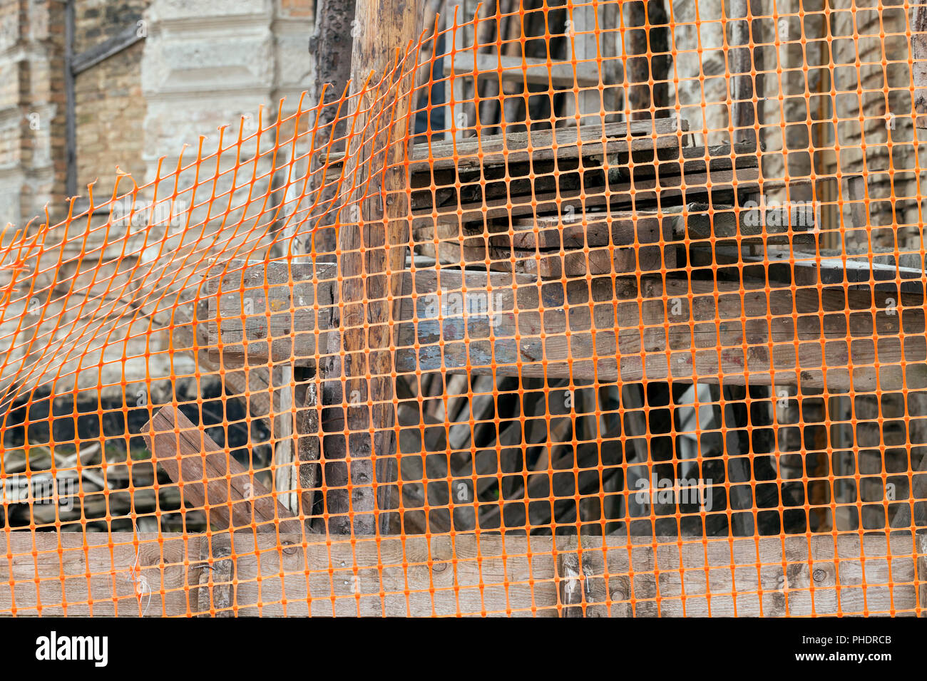 fenced with orange plastic net construction site to ensure the safety ...