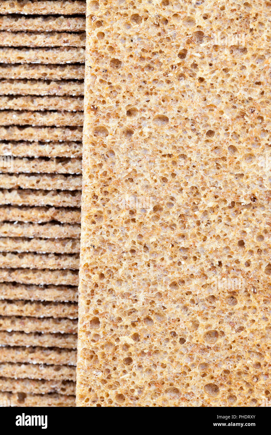 thin crispy rye bread stacked on top of each other, background of food ...