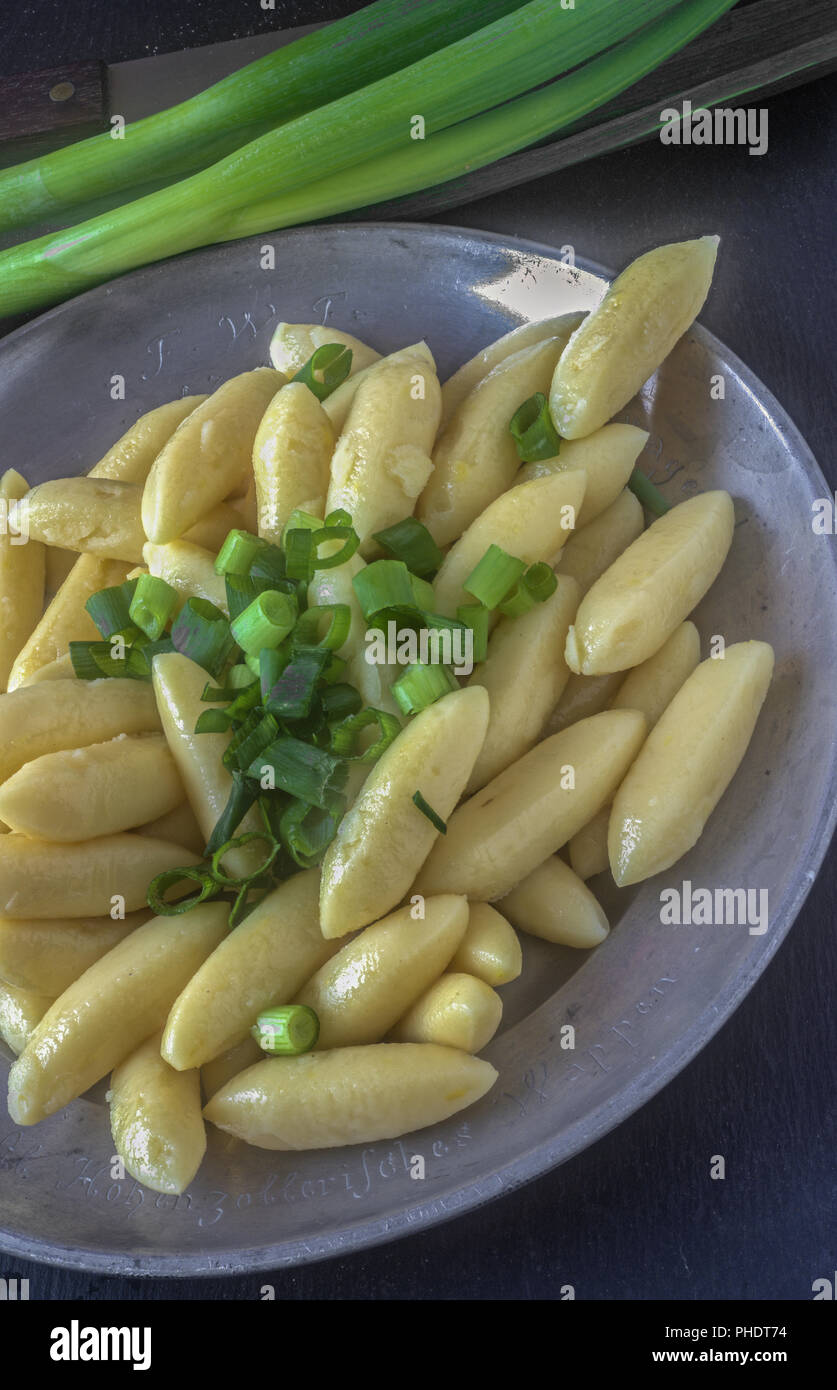 Finger-shaped potato dumplings, Swabian specialty Stock Photo - Alamy