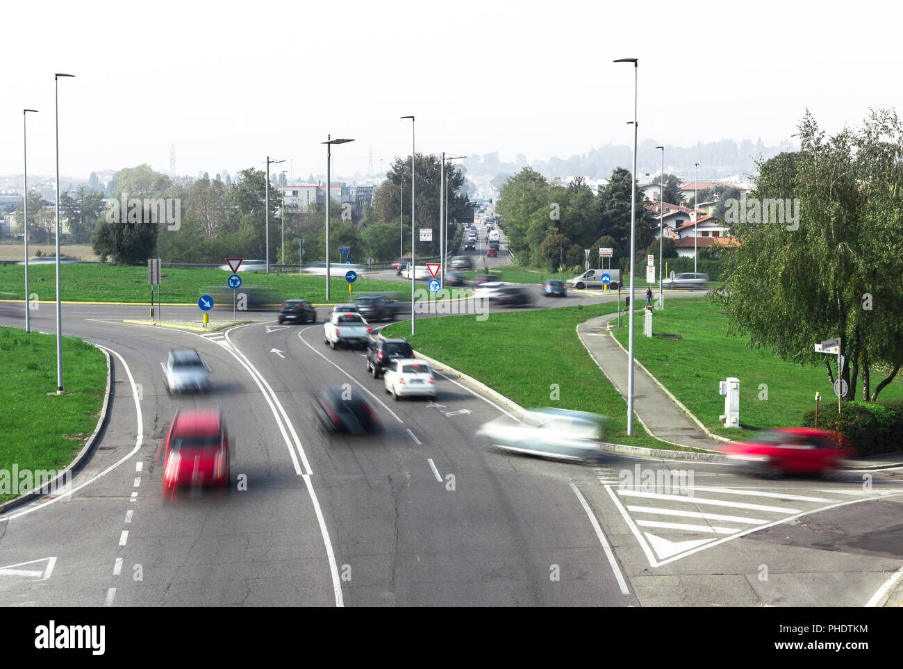 Road traffic at roundabout junction Stock Photo - Alamy