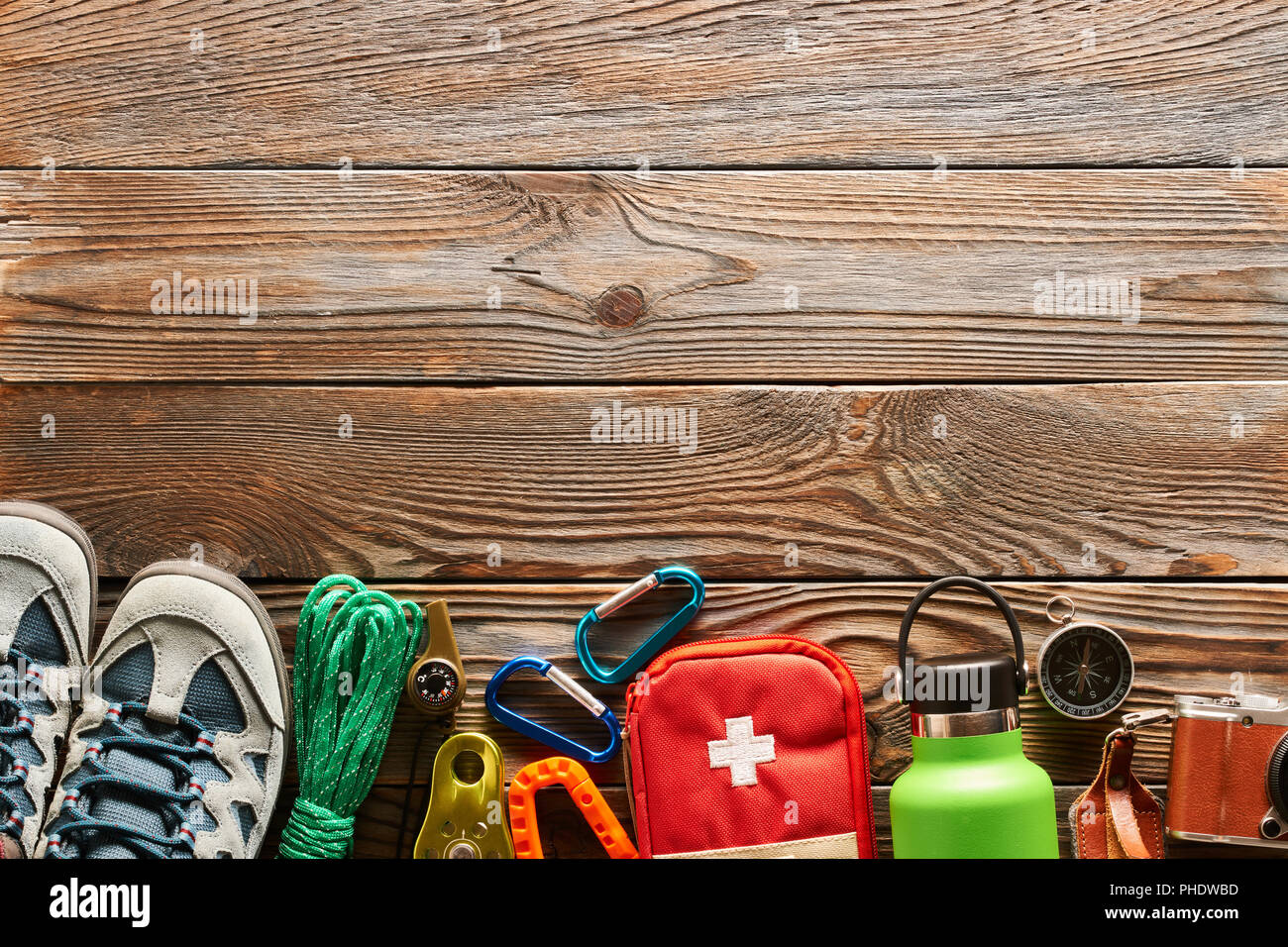 Travel items for hiking over wooden background Stock Photo - Alamy