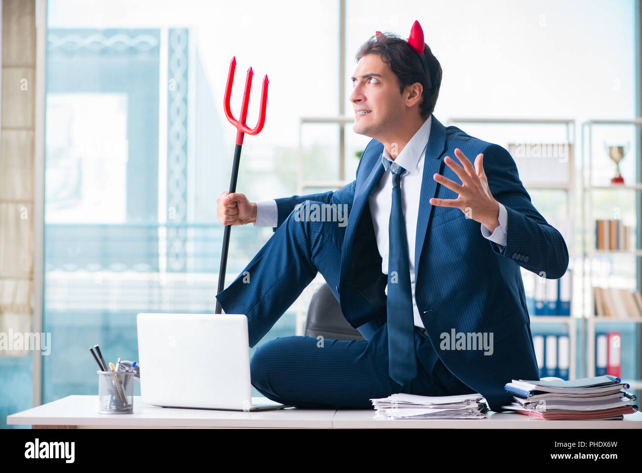 Devil angry businessman in the office Stock Photo - Alamy