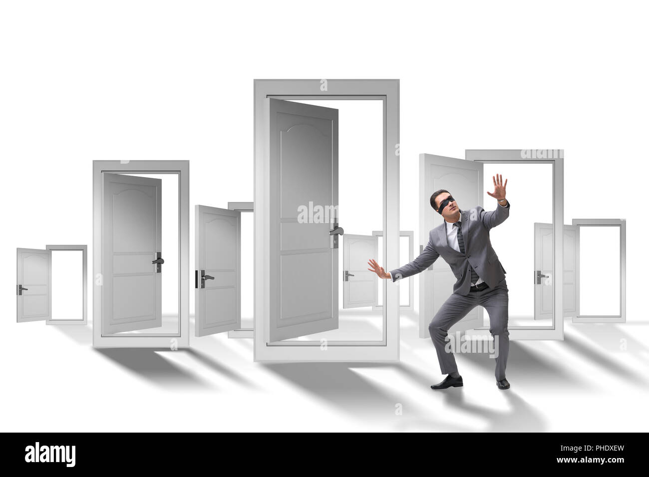 Confused businessman in front of doors Stock Photo - Alamy