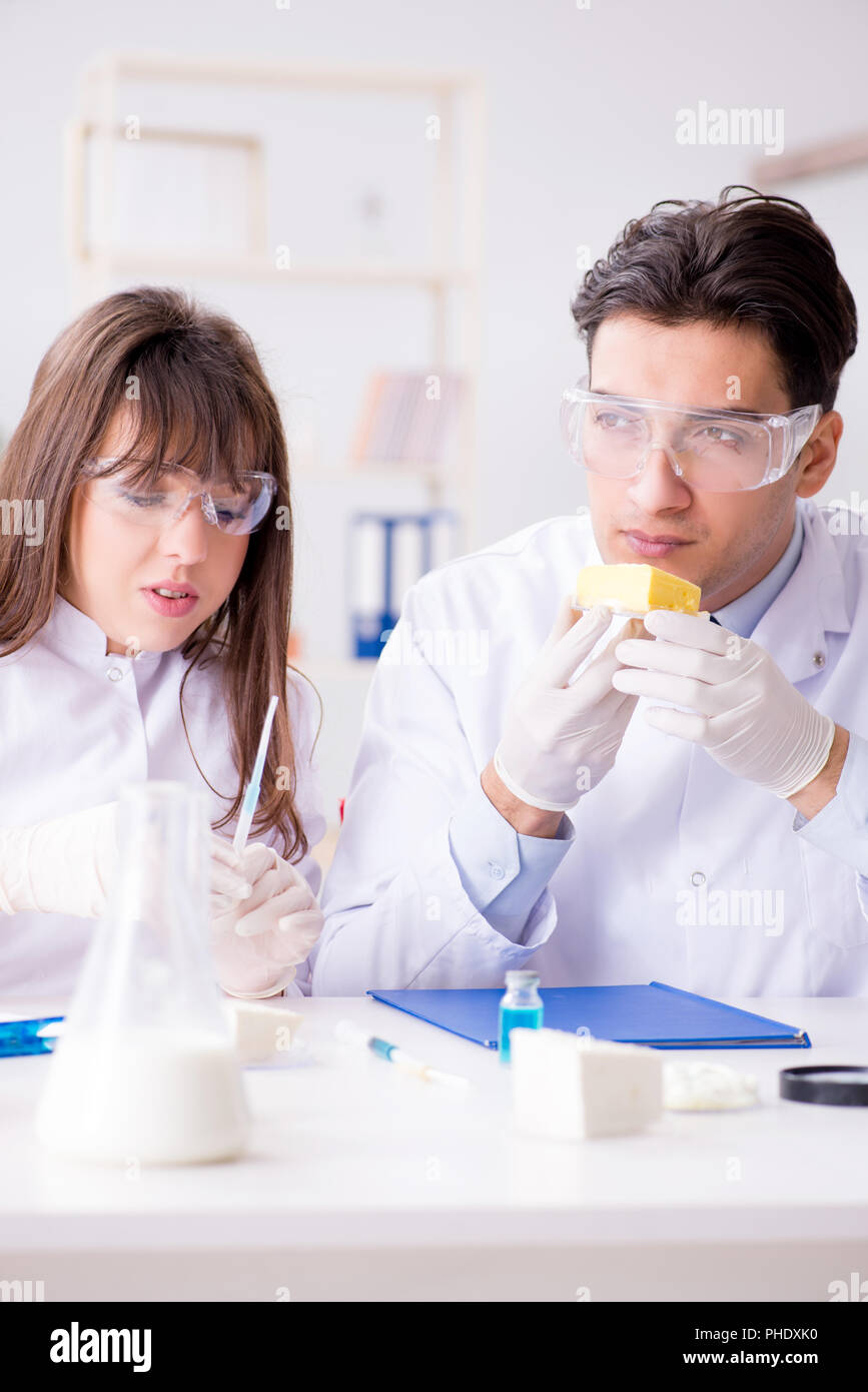 Two lab doctor testing food products Stock Photo - Alamy