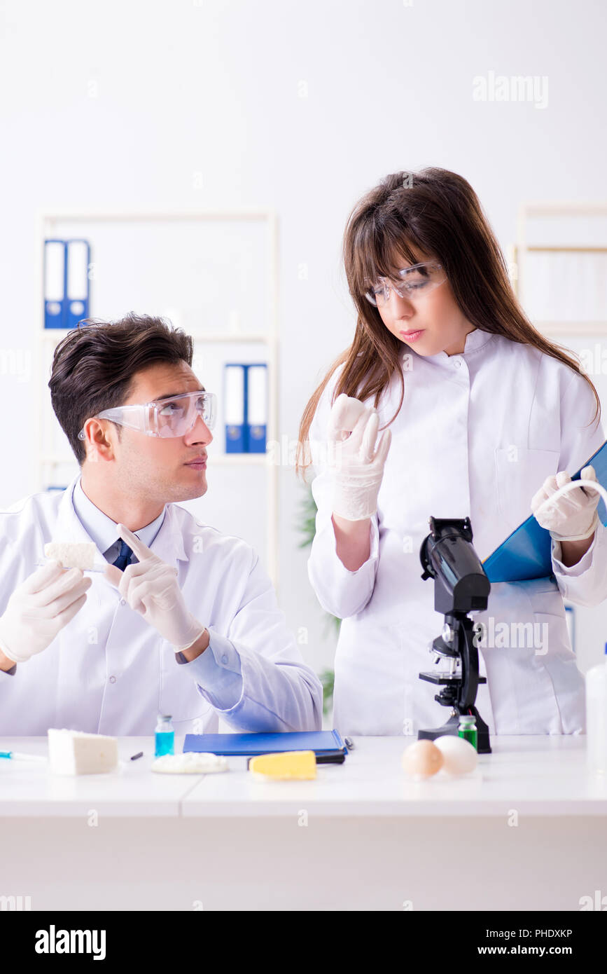 Two lab doctor testing food products Stock Photo - Alamy