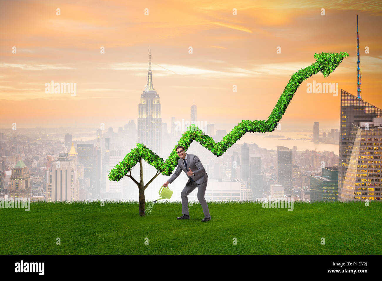 Businessman in investment concept watering financial line chart Stock ...