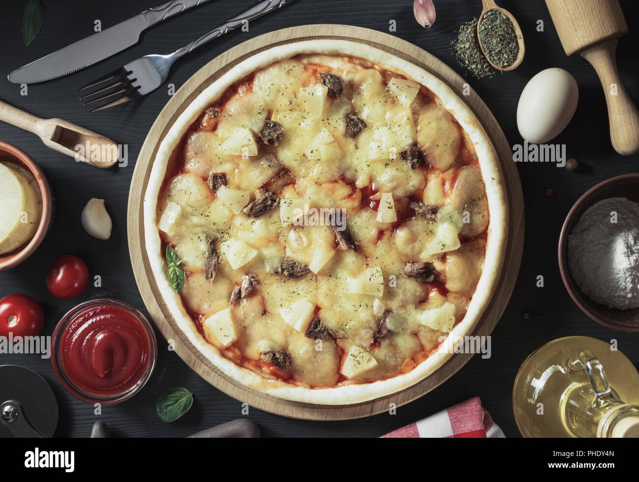 italian pizza at old table background Stock Photo - Alamy