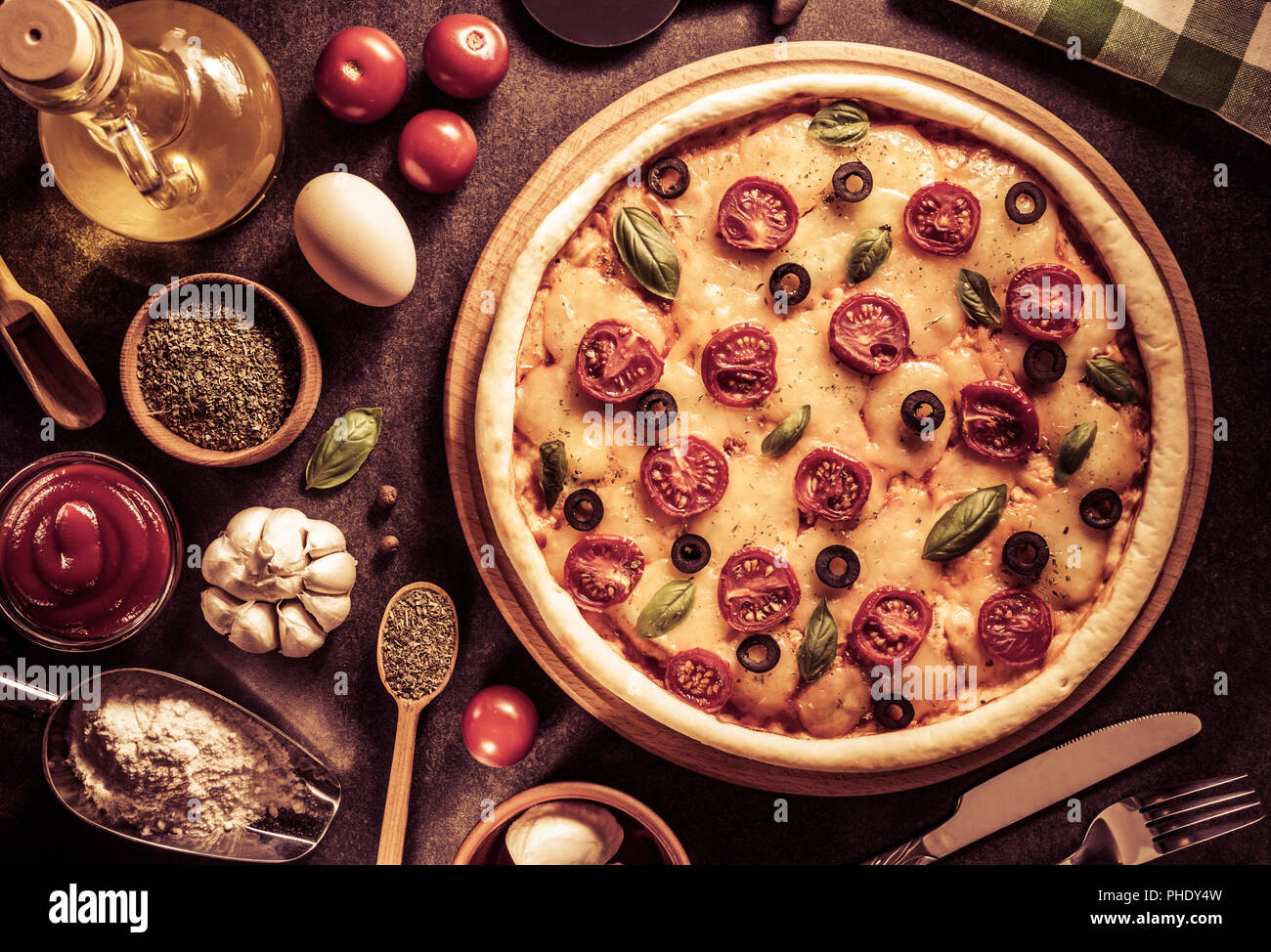 italian pizza at old table background Stock Photo - Alamy