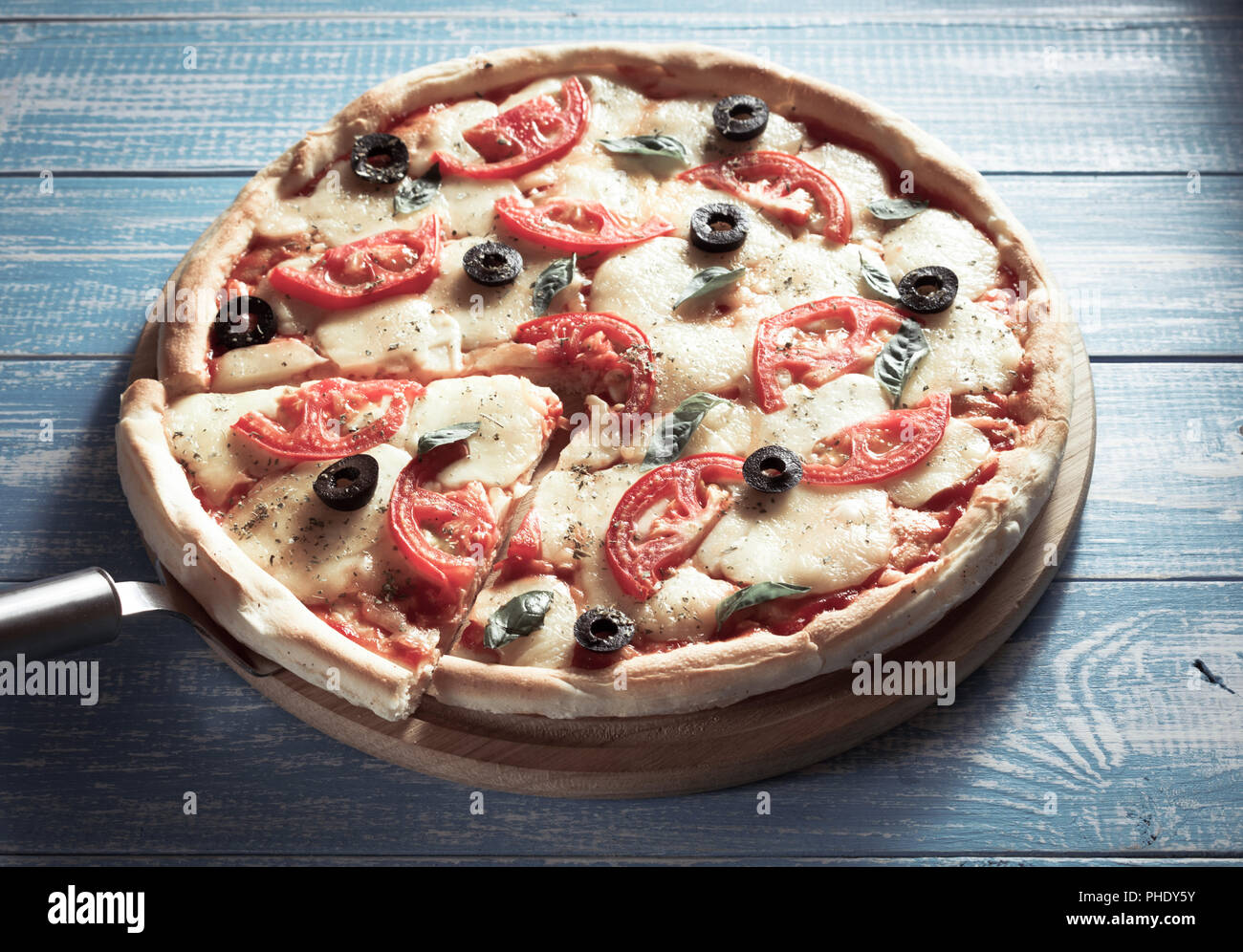 italian pizza at old table background Stock Photo - Alamy