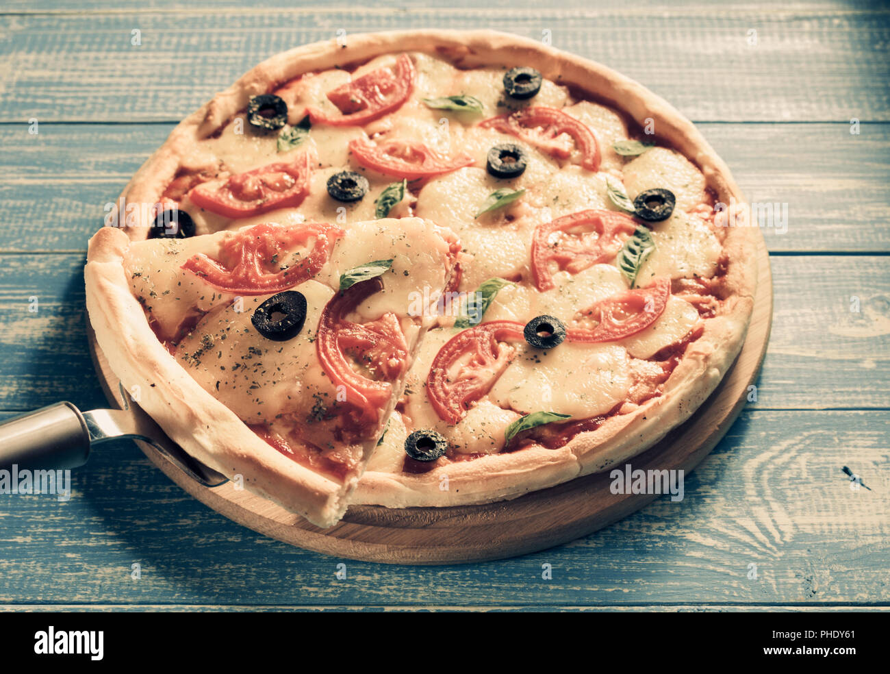 italian pizza at old table background Stock Photo - Alamy