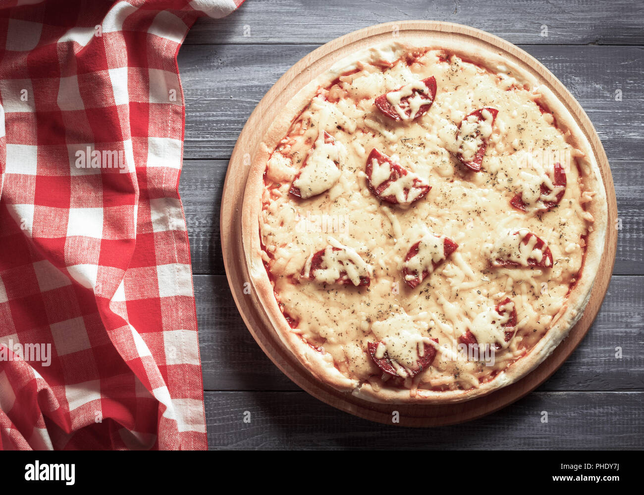 italian pizza at old table background Stock Photo - Alamy
