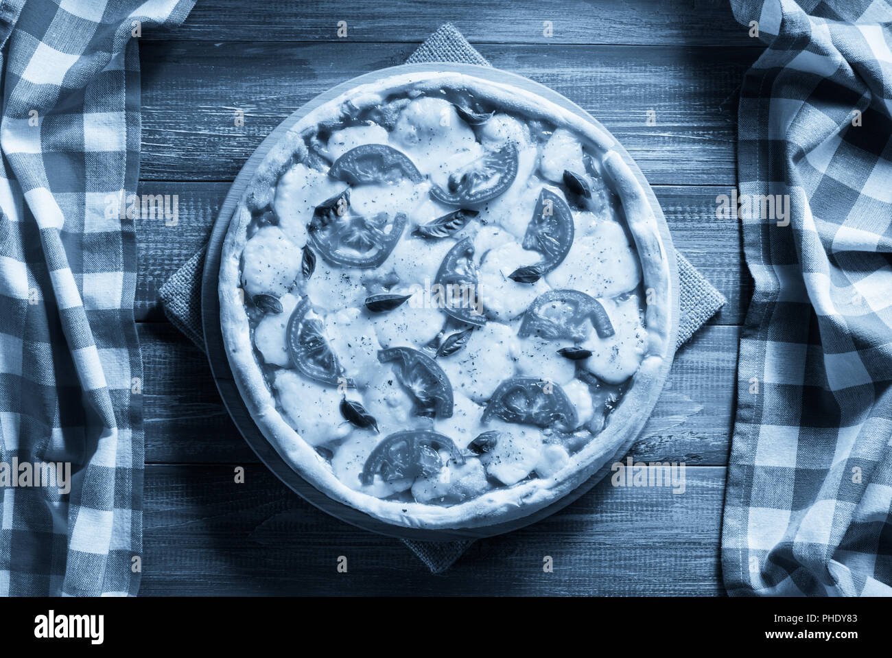 italian pizza at old table background Stock Photo - Alamy