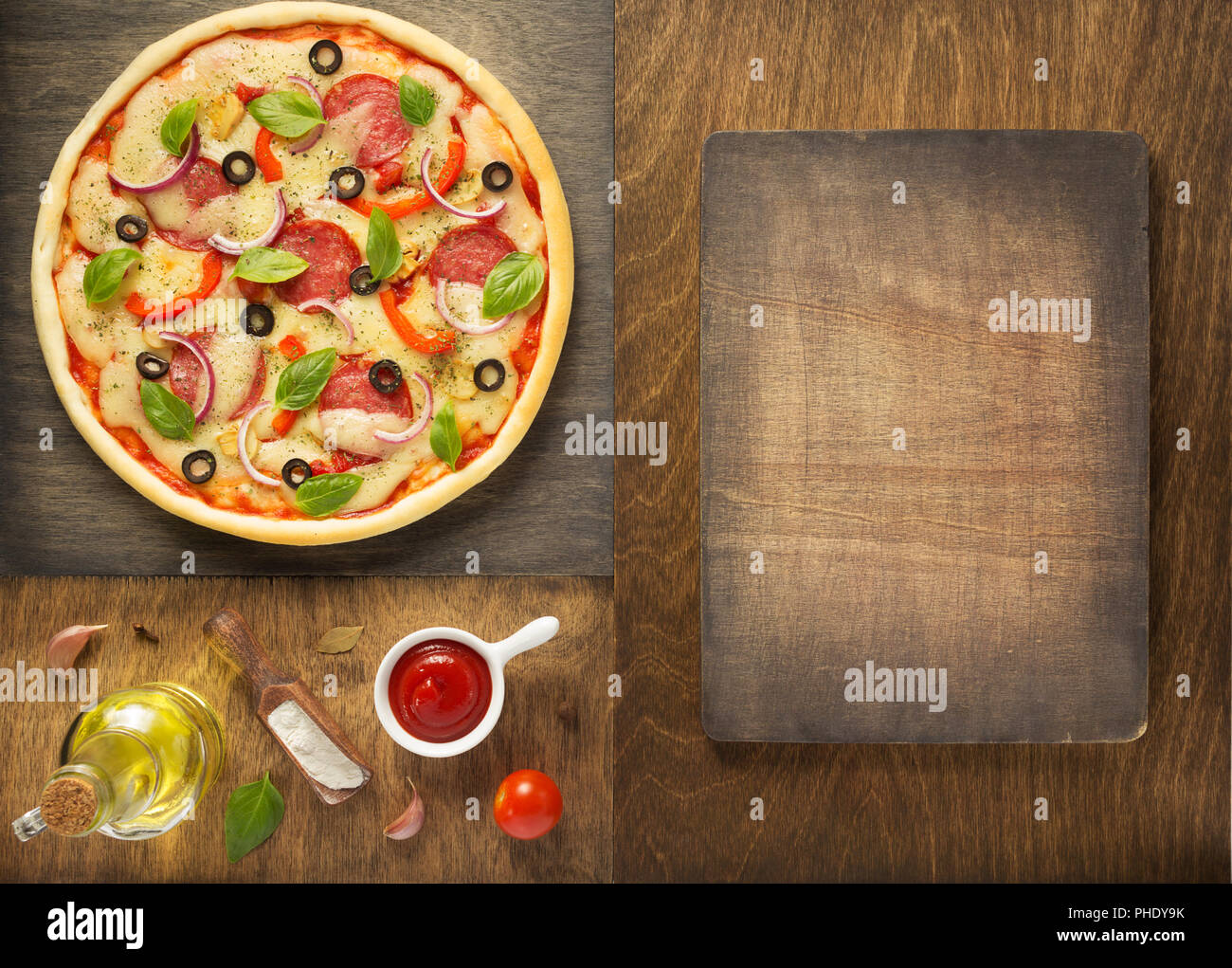 italian pizza at old table background Stock Photo - Alamy
