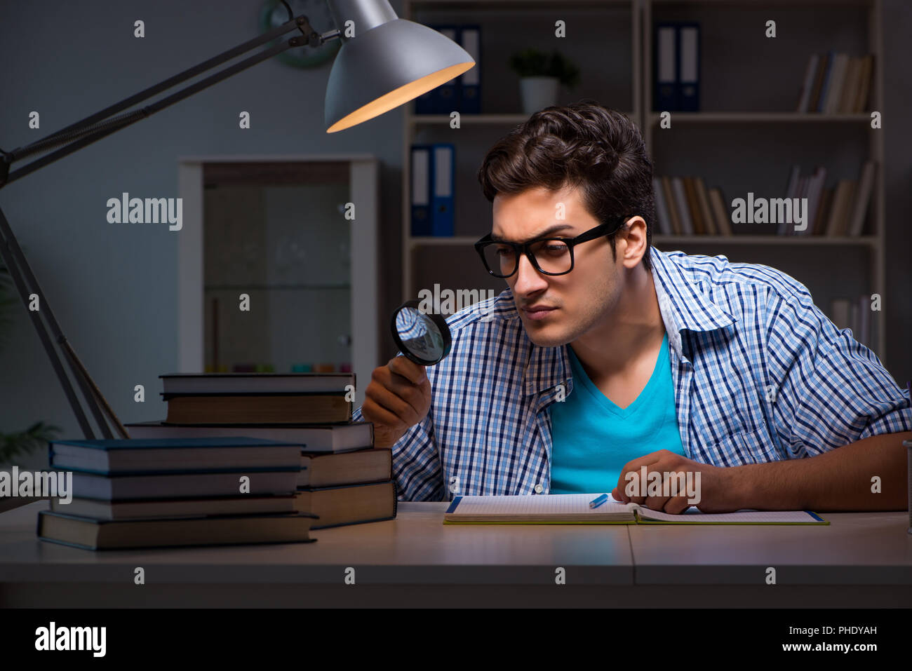 Student preparing for exams late night at home Stock Photo - Alamy