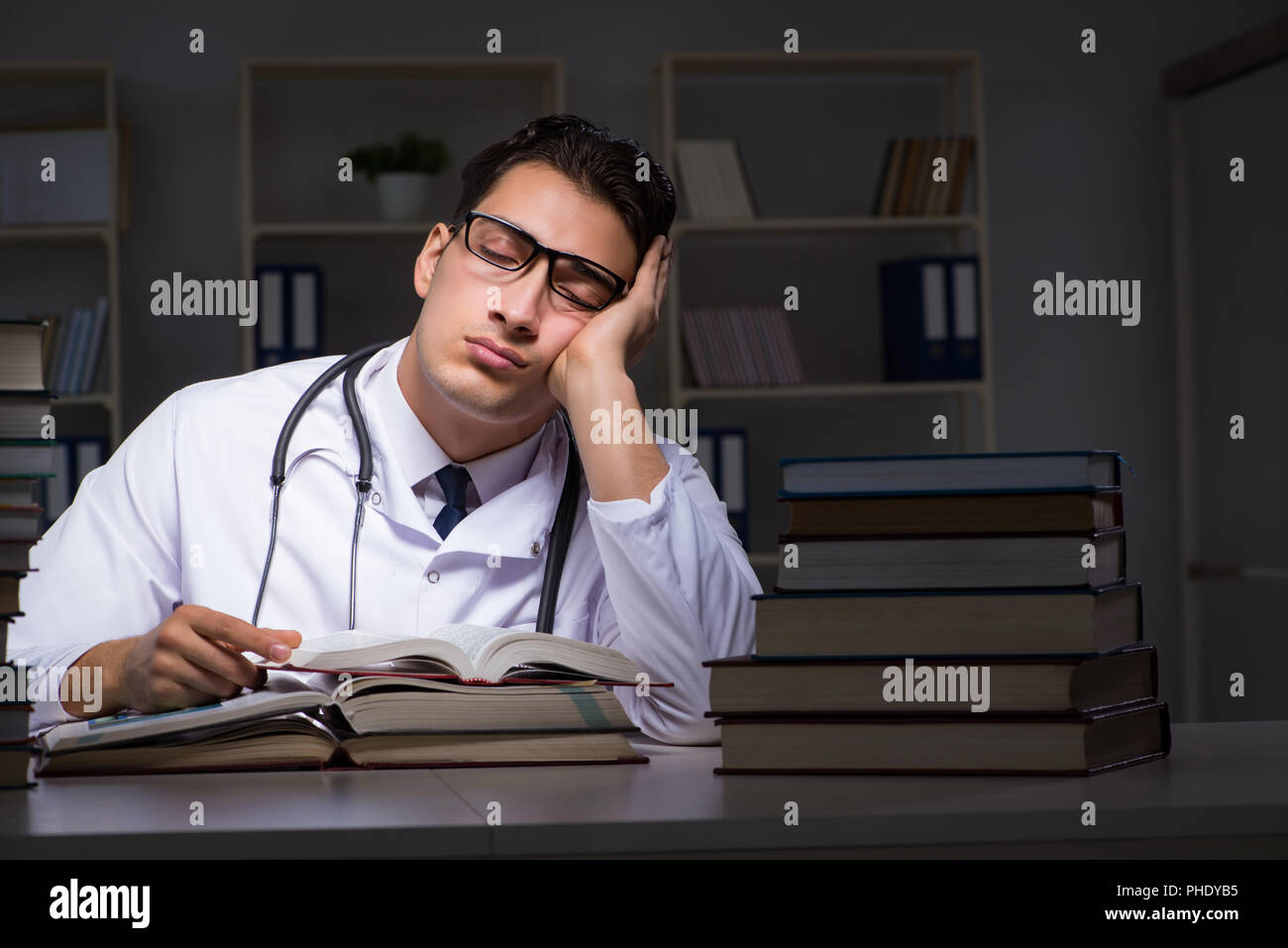 Medical student preparing for university exams at night Stock Photo - Alamy