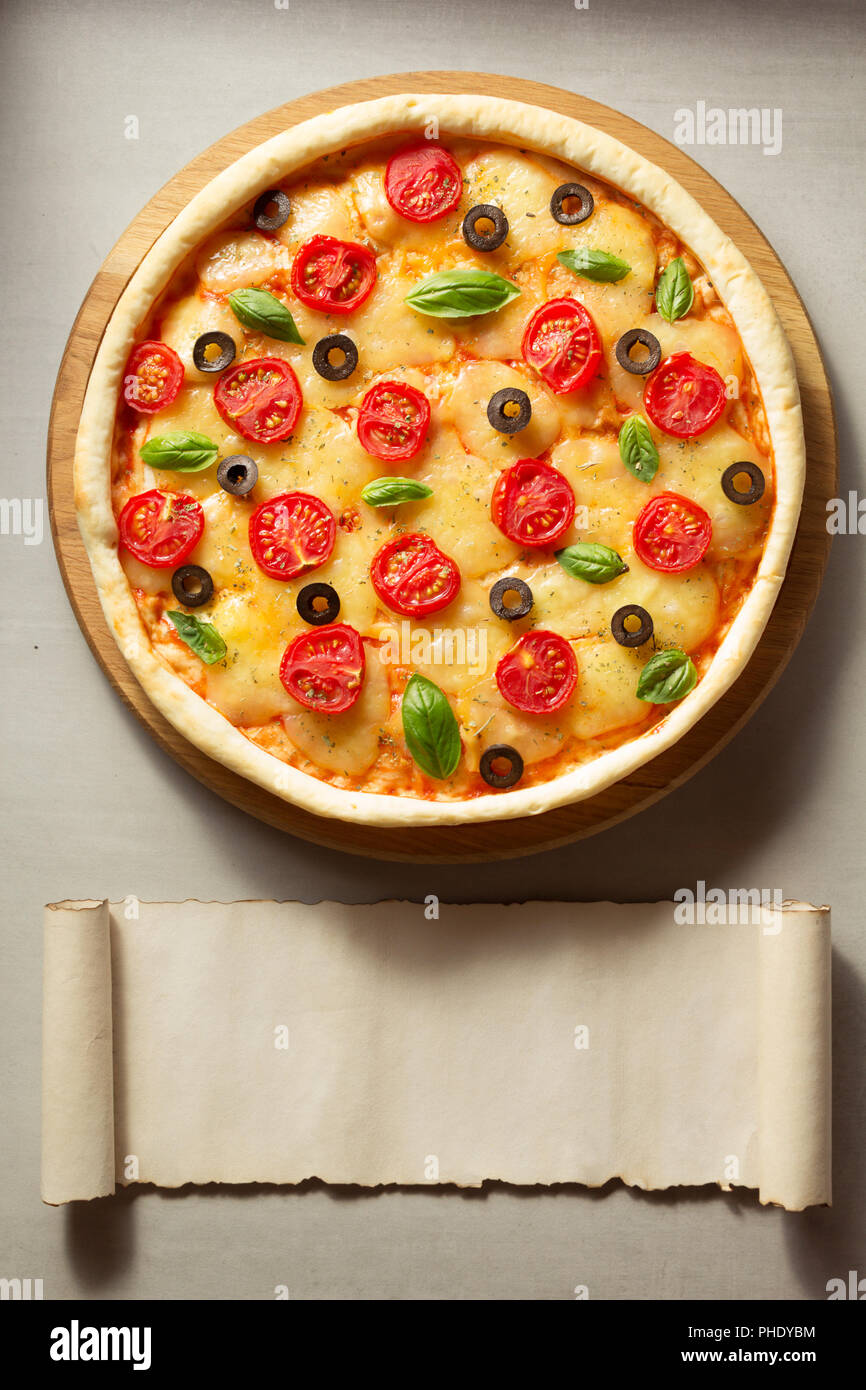 italian pizza at old table background Stock Photo - Alamy