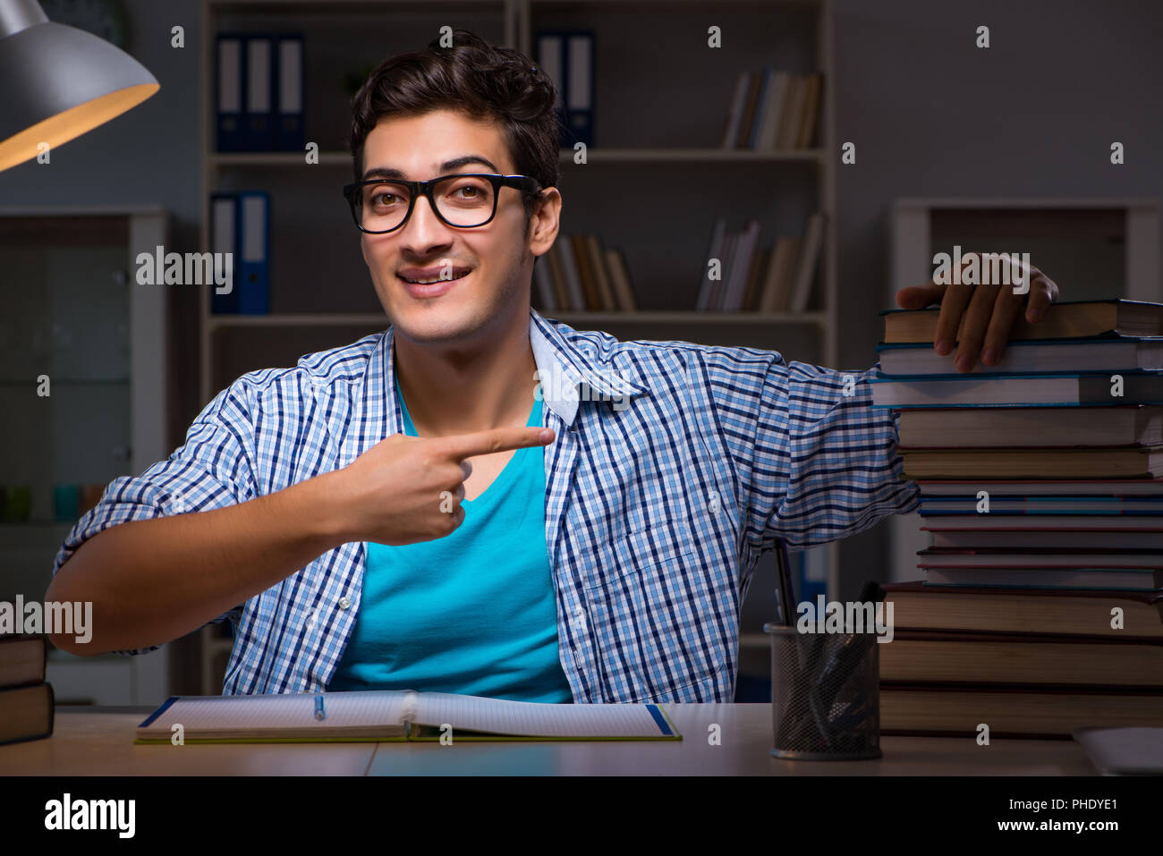 Student preparing for exams late night at home Stock Photo - Alamy