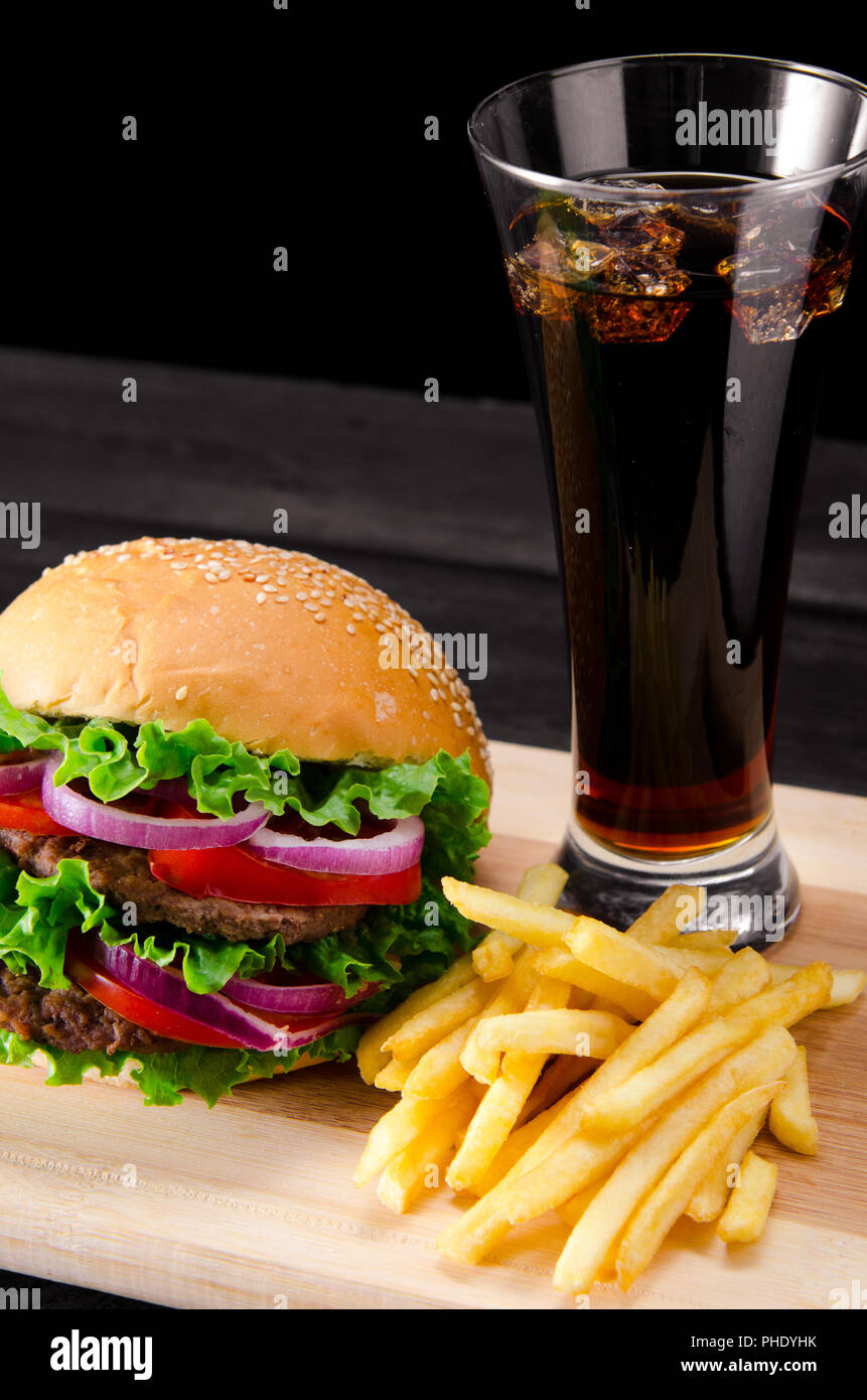 Burger served in bun in nutrition fast food concept Stock Photo - Alamy