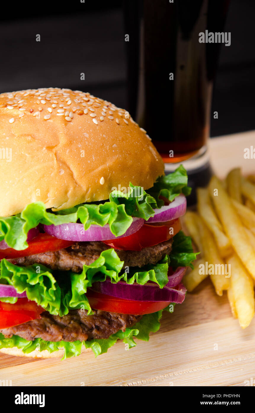Burger served in bun in nutrition fast food concept Stock Photo - Alamy