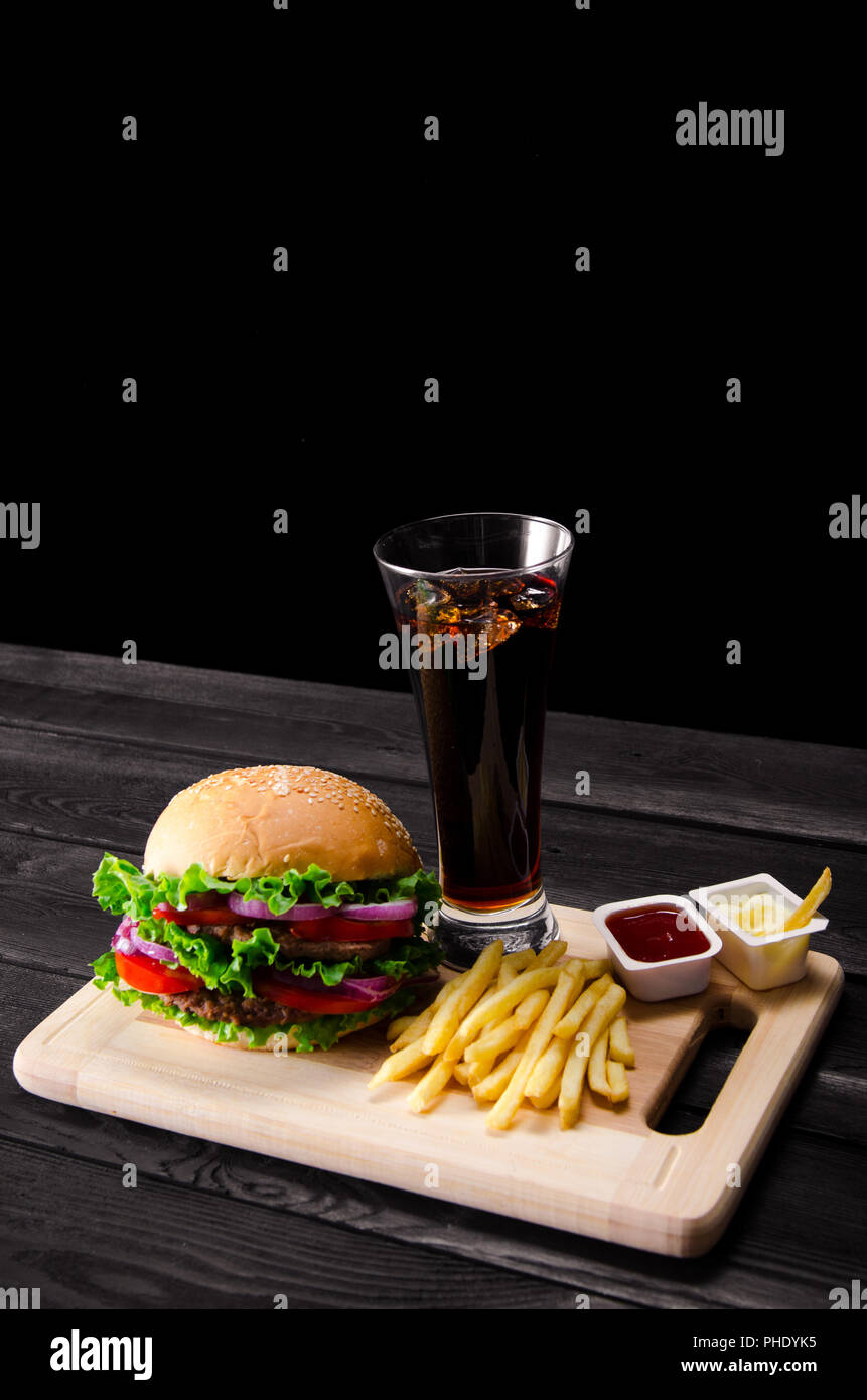Burger served in bun in nutrition fast food concept Stock Photo - Alamy