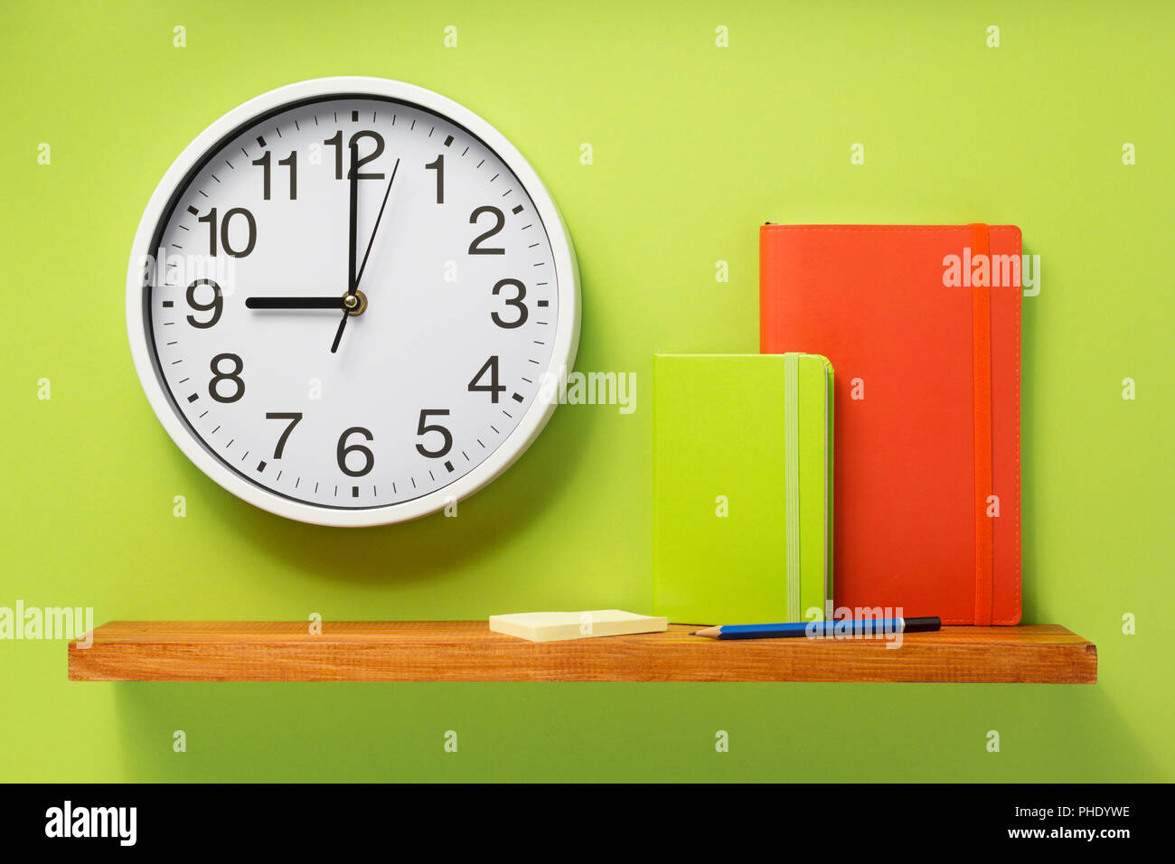 notepad and book on shelf at wall background surface Stock Photo - Alamy