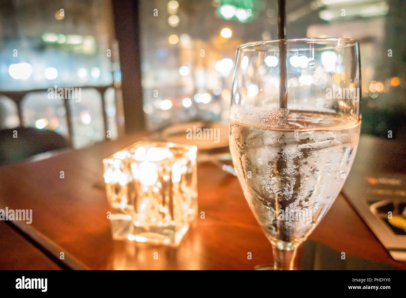 candle at night with city street lights in the background Stock Photo ...