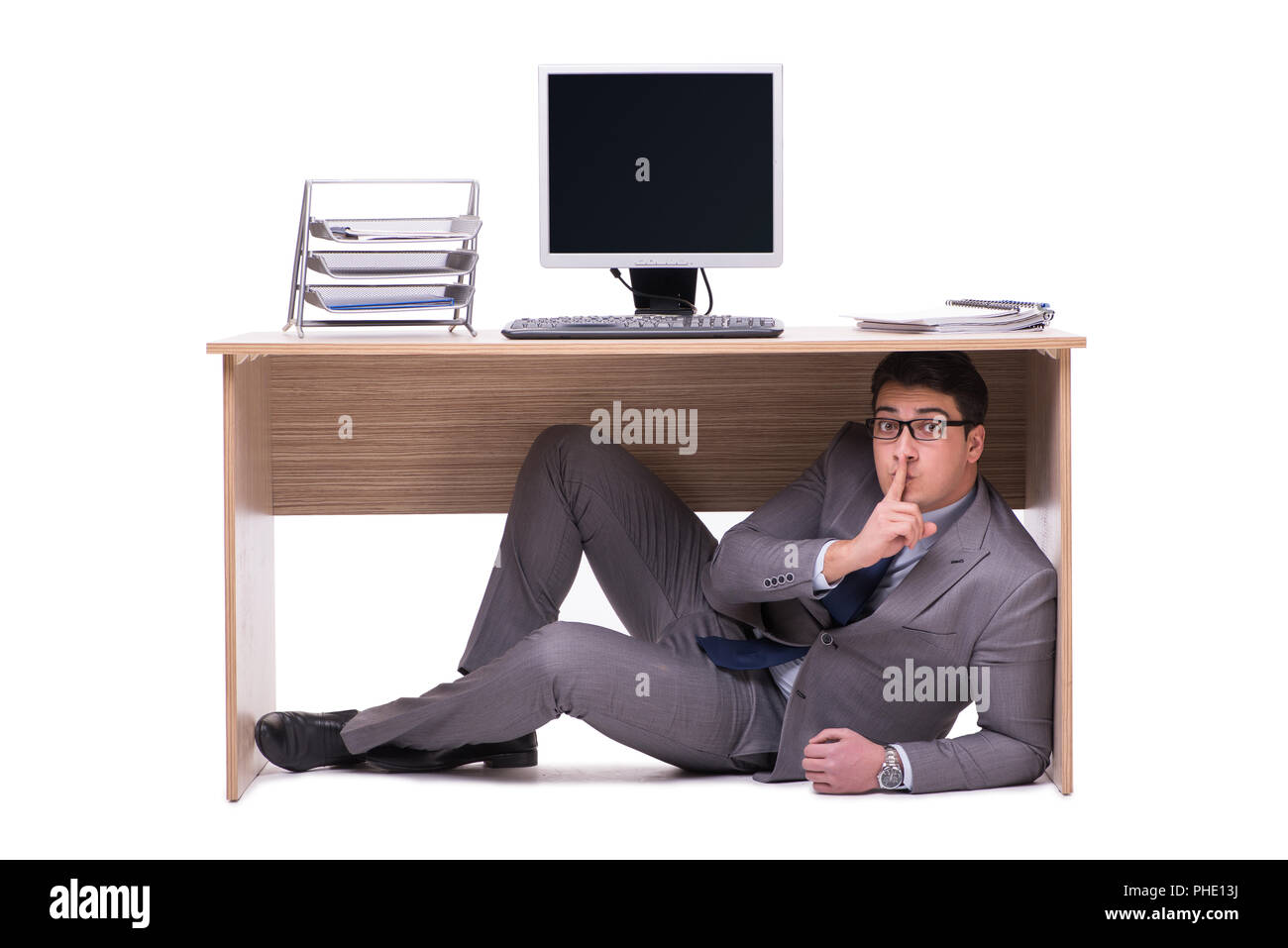 Person hiding under desk hi-res stock photography and images - Alamy