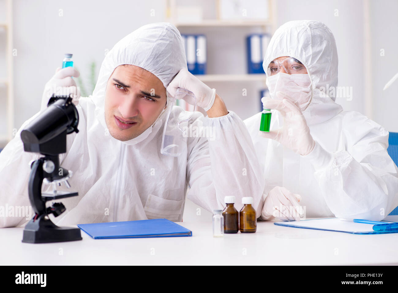 Two chemists working in the lab Stock Photo - Alamy