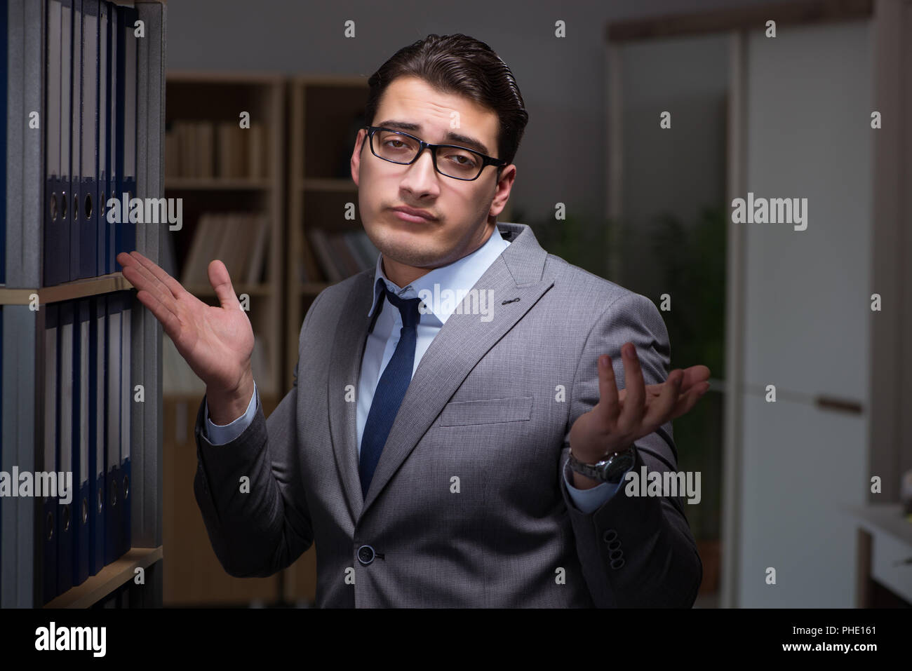 Businessman working late hours in the office Stock Photo - Alamy