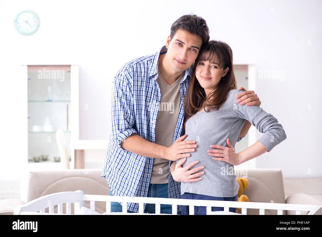 Joyful young parents hugging hi-res stock photography and images - Alamy